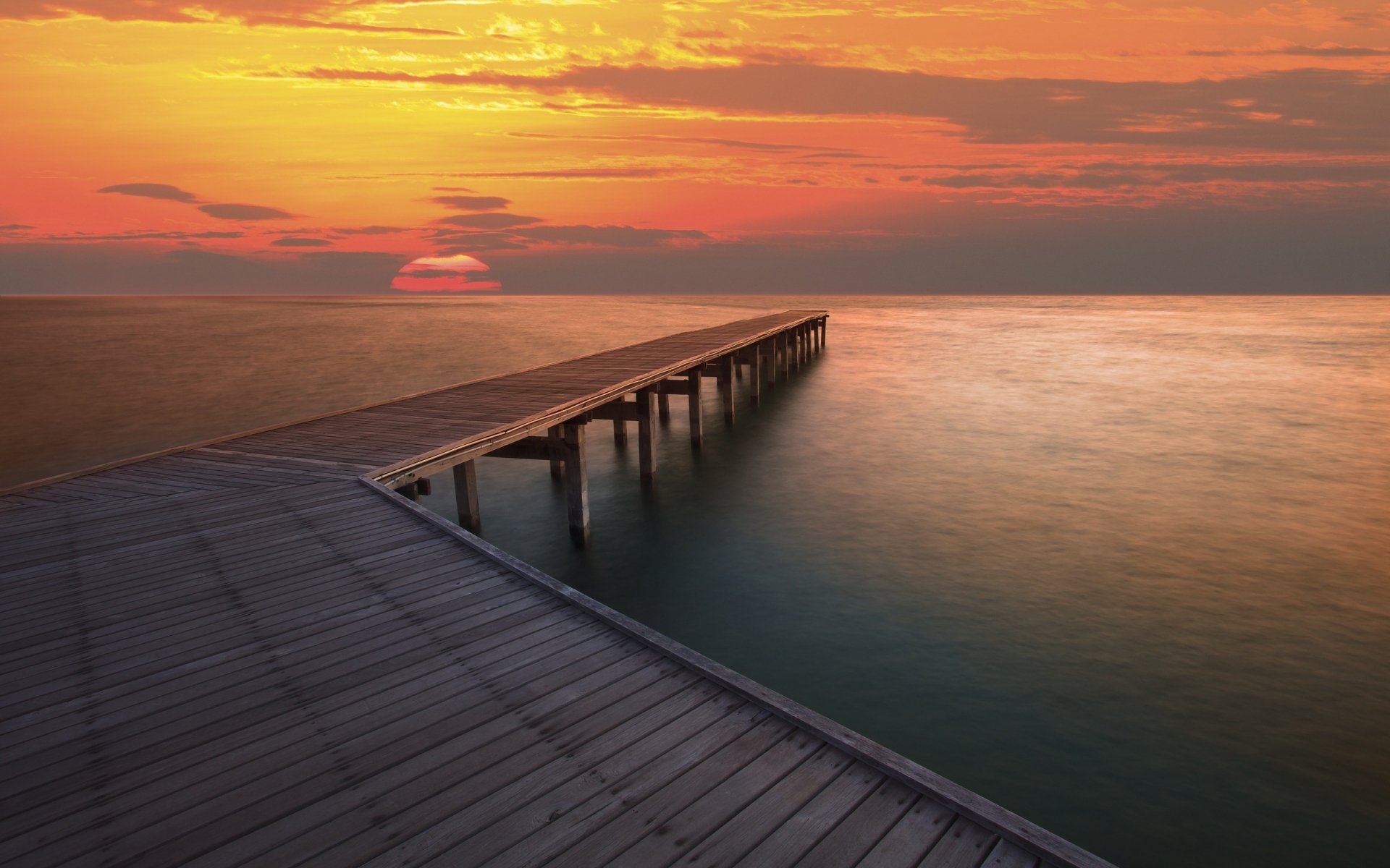 Sunset Serenity: HD Pier Over Calm Waters | 2560x1600 | Wallpaper Abyss