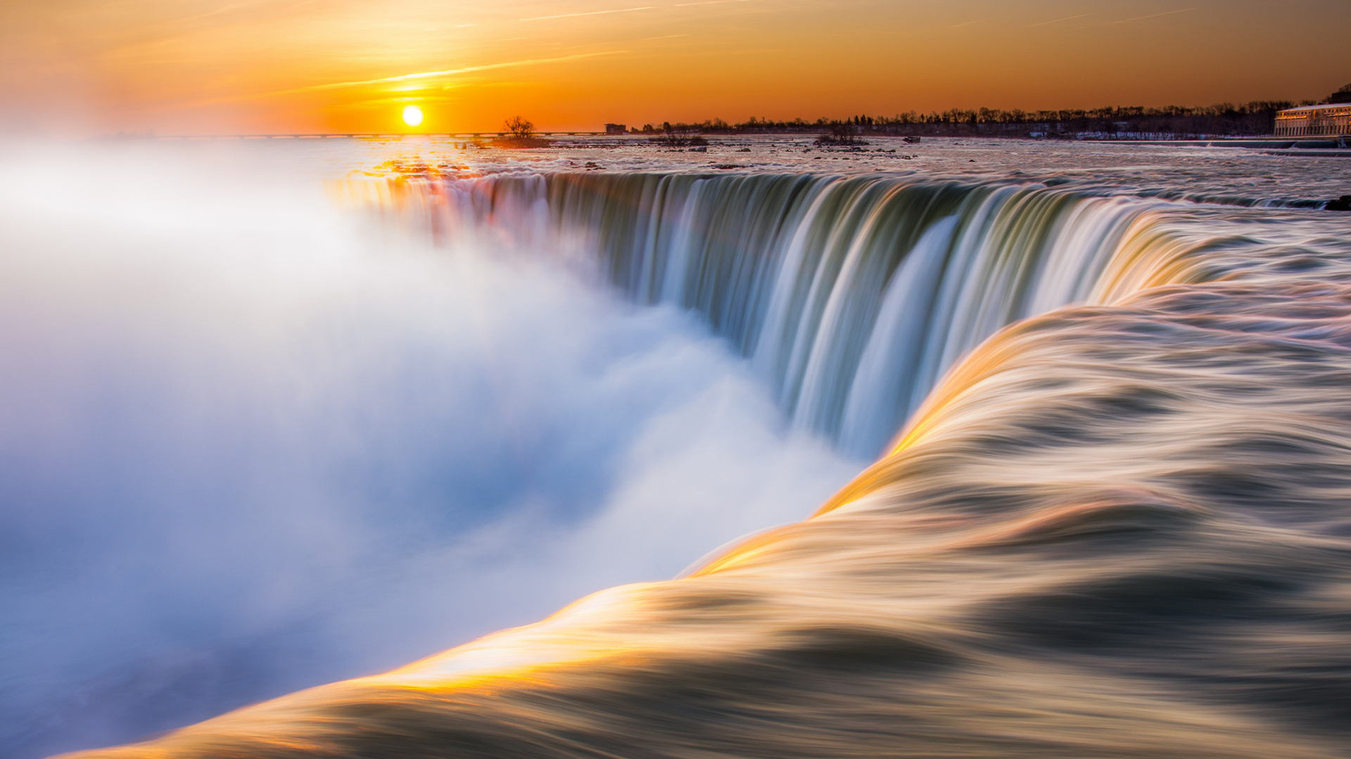 Majestic Waterfall at Sunset - HD Wallpaper