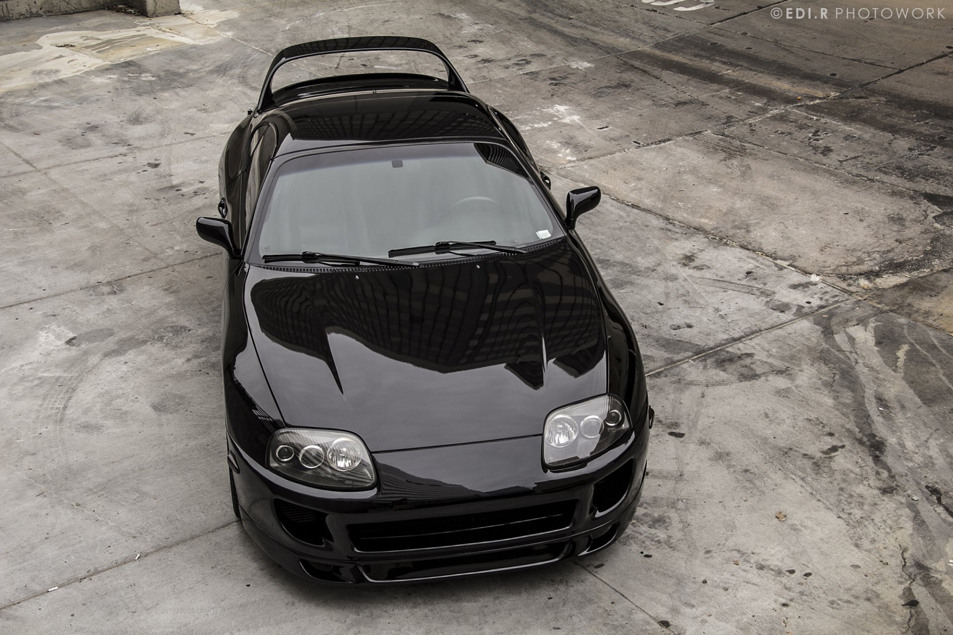 Sleek Black Toyota Supra HD Wallpaper – Power and Style in Motion