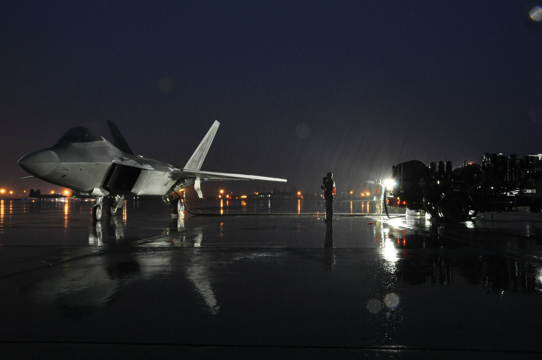 Lockheed Martin F-22 Raptor: Stunning HD Military Nighttime Wallpaper