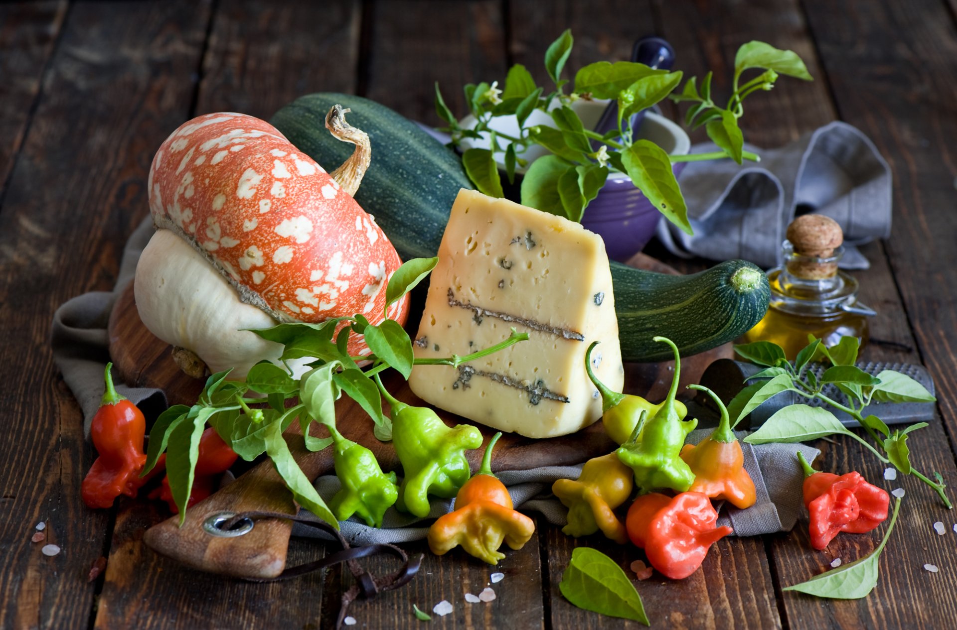 Rustic Harvest: Vibrant Peppers, Pumpkins & Artisan Cheese HD Wallpaper