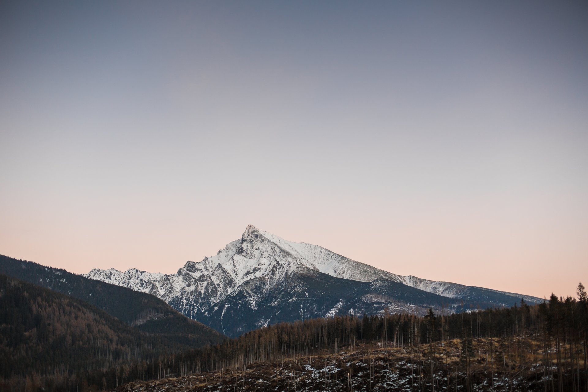 4K Ultra HD Majestic Mountain Peak Over Forested Landscape at Dawn ...