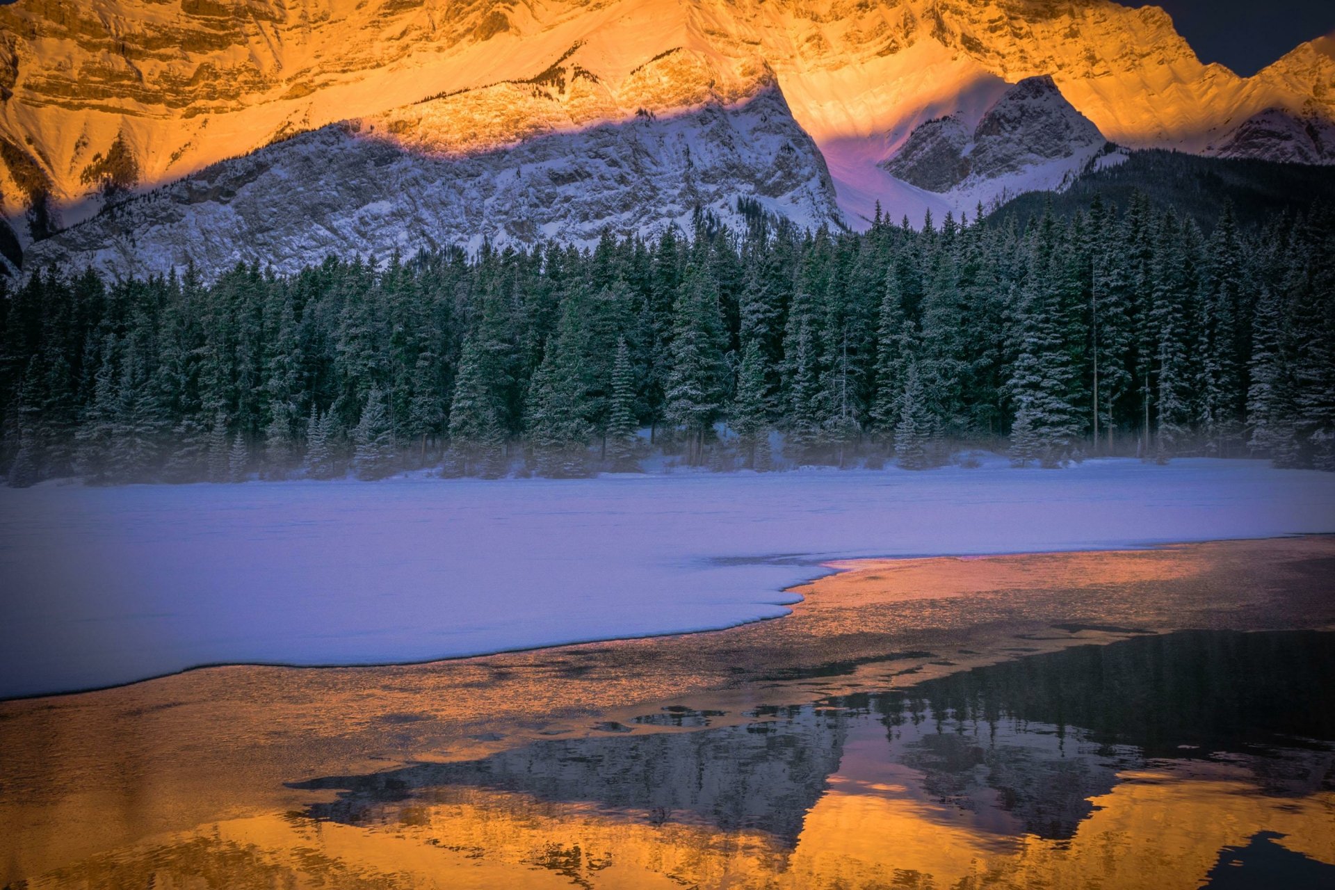 Two Jack Lake Winter Glow: Frozen Beauty of Canada's Forested Wilderness