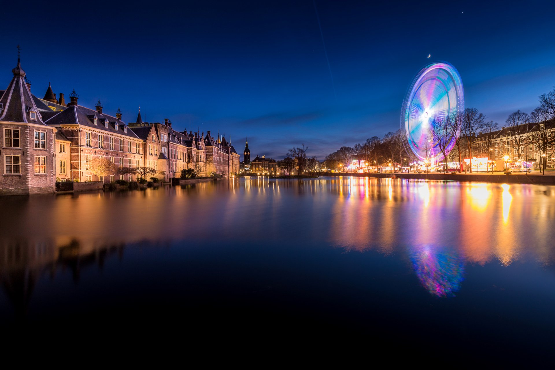 Night Lights Over The Hague: Ferris Wheel Reflections on the River