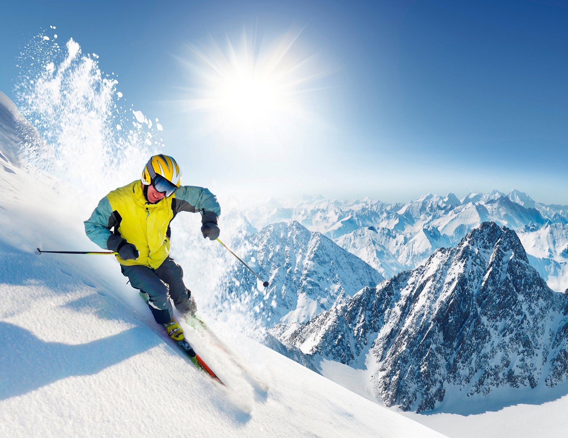 Sunlit Winter Rush: Skiing the Snowy Mountain Peaks – HD Sports Wallpaper