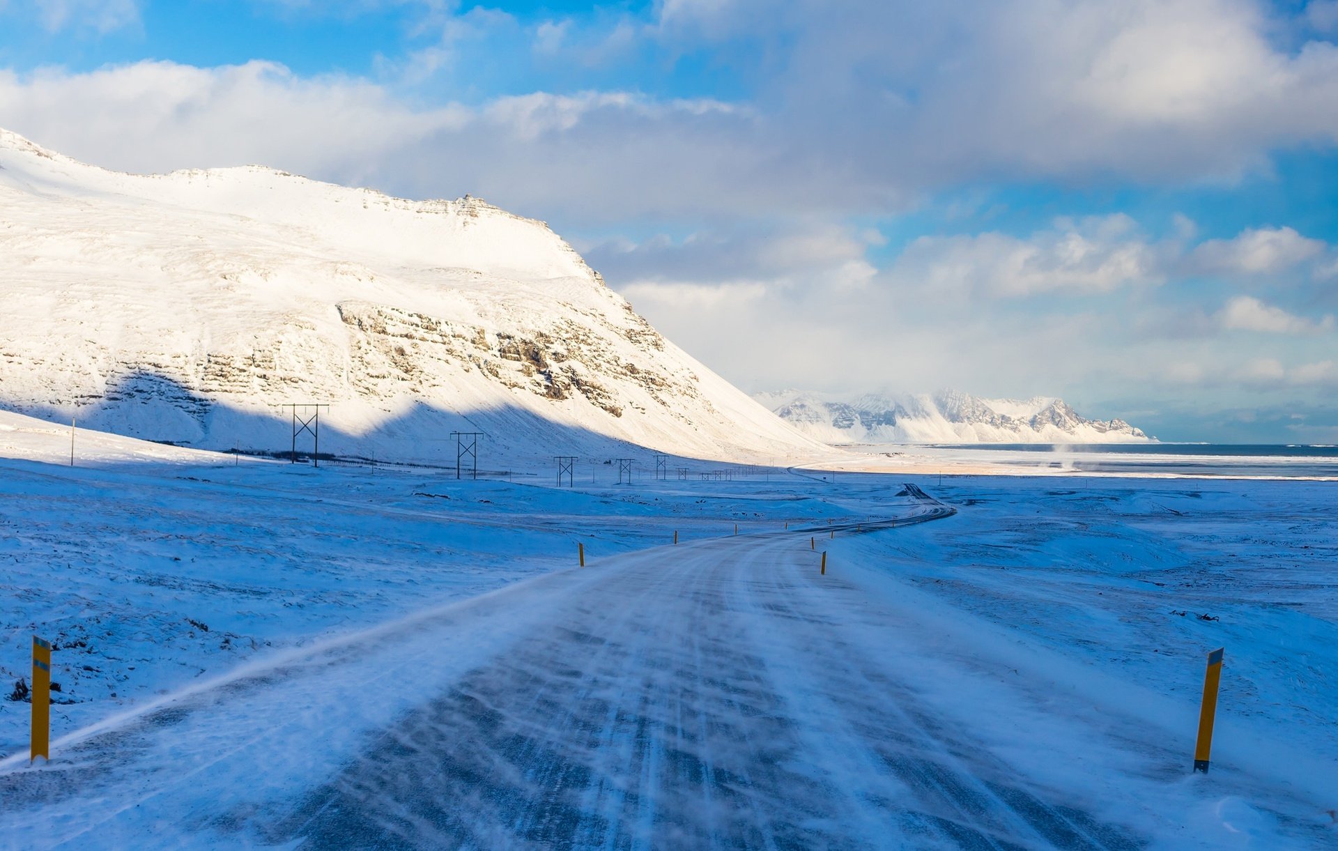 Winter's Road: A Stunning Snow-Covered Earthscape HD Wallpaper