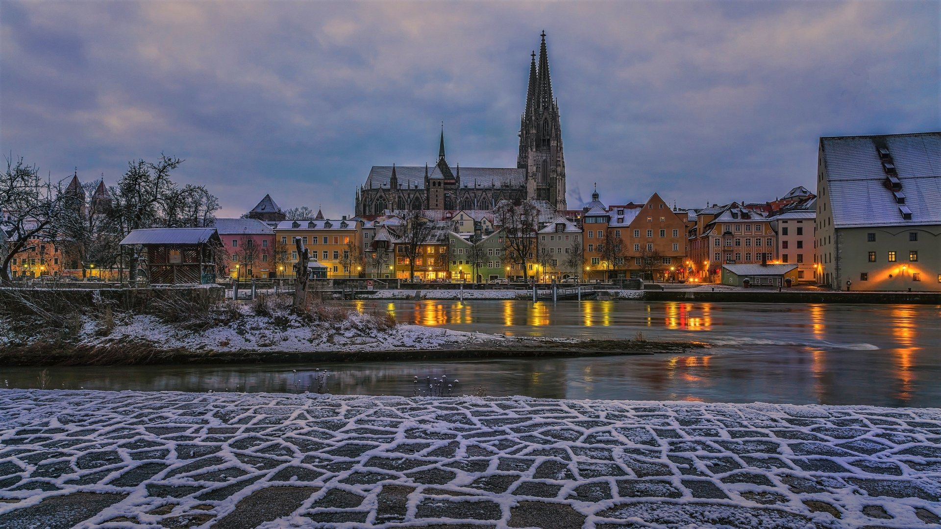 Winter Twilight Over Germany’s Historic Snow-Covered Church Townscape